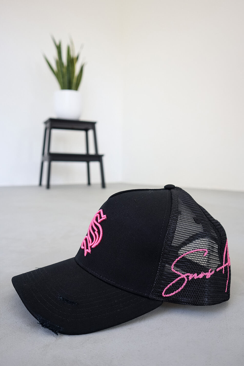 Sinners Attire Black/Neon Pink Distressed Trucker Hat